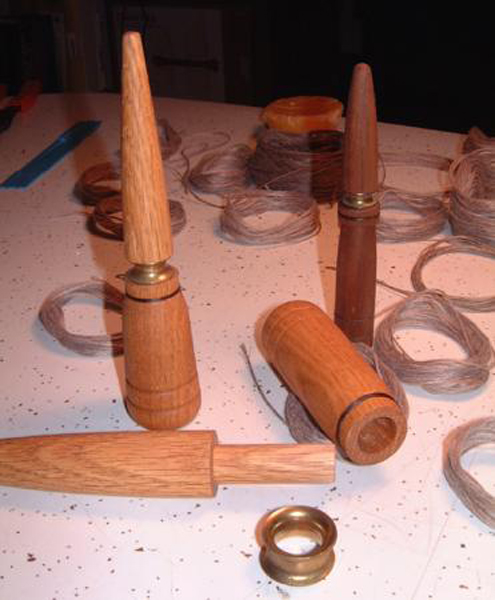 Sailmaking and sailmaker's tools. sail making, canvas sewing